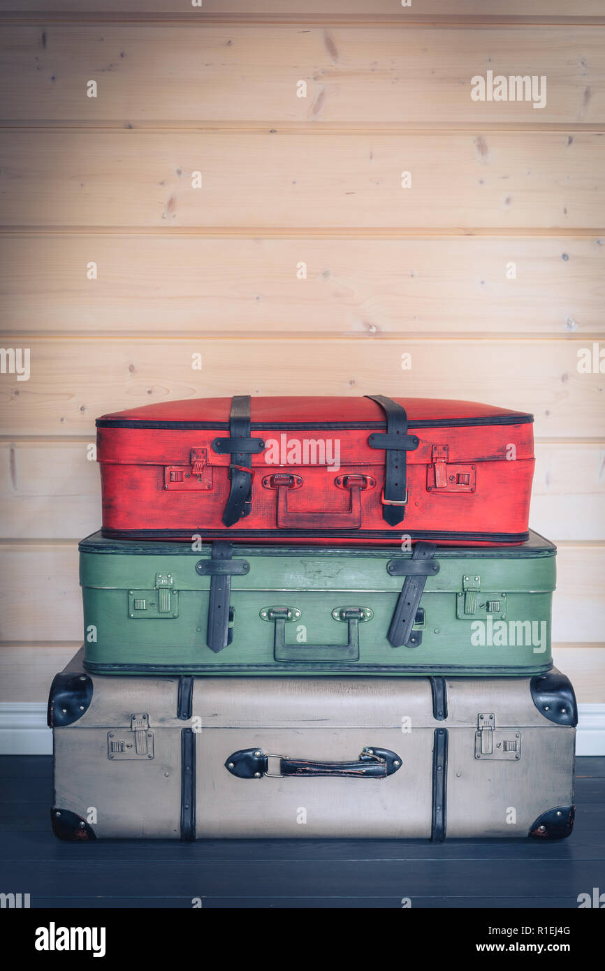 Vintage colourful pile of suitcases, travel luggage concept, toned ...