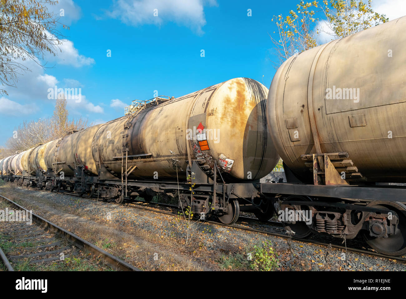 Diesel locomotive delivering oil in tanks in the industrial area Stock ...