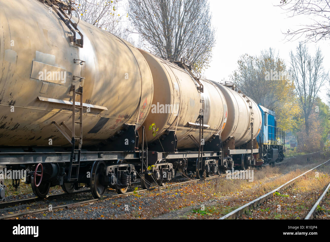 Diesel locomotive delivering oil in tanks in the industrial area Stock ...