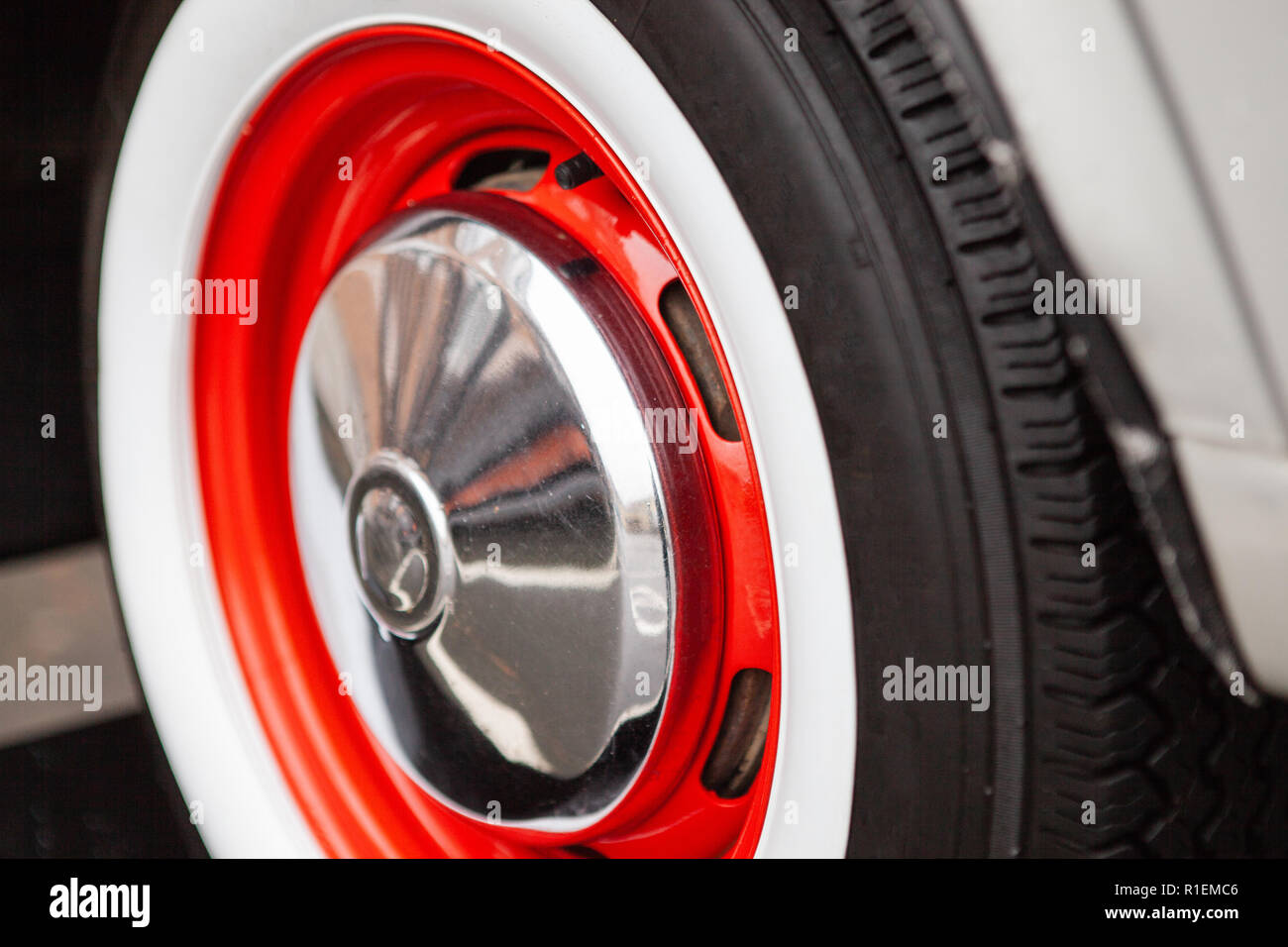 Vintage car wheel, painted red, the concept of the history of the ...