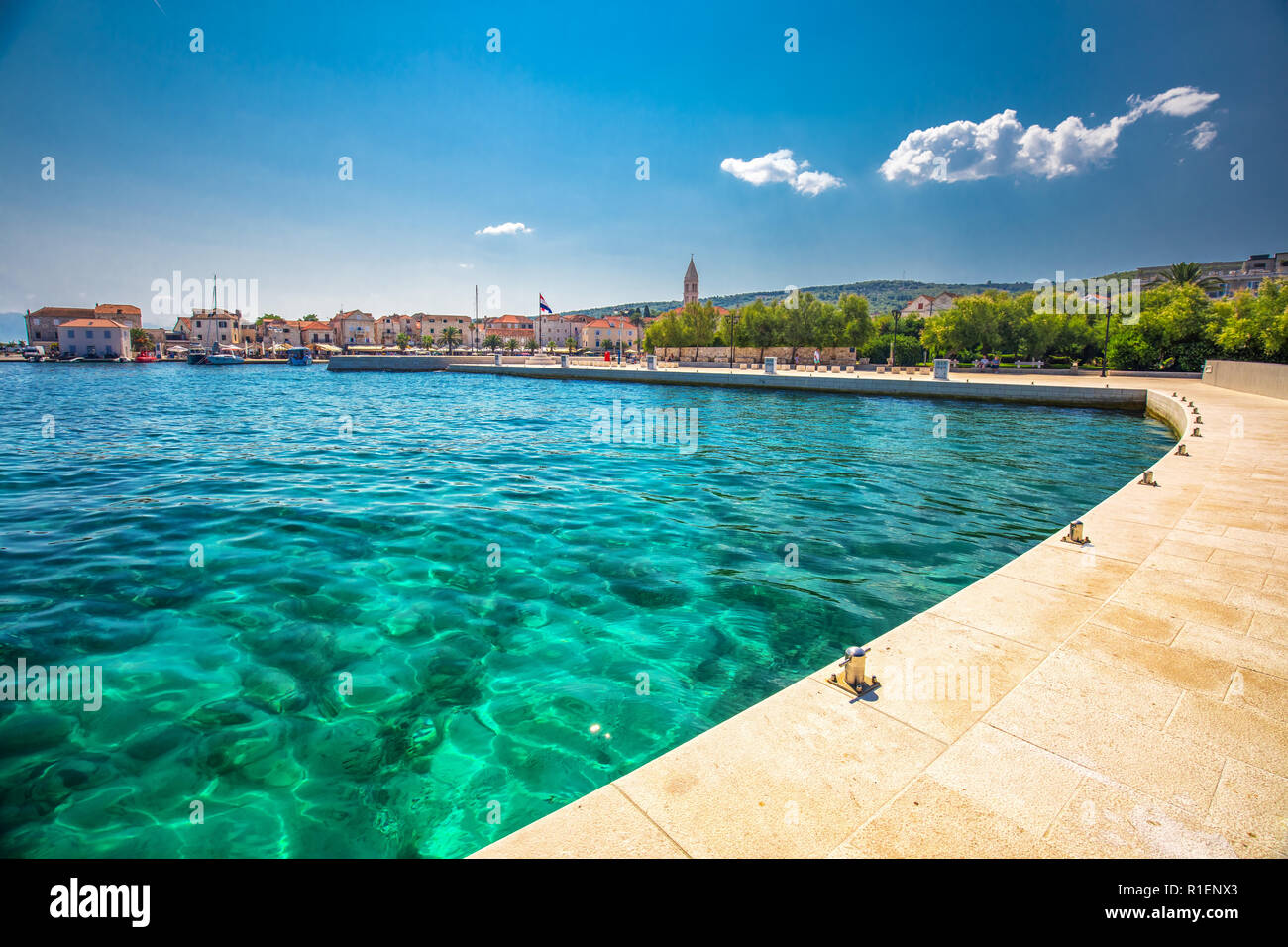 Seaside promenade in Supetar town on Brac island with palm trees and ...