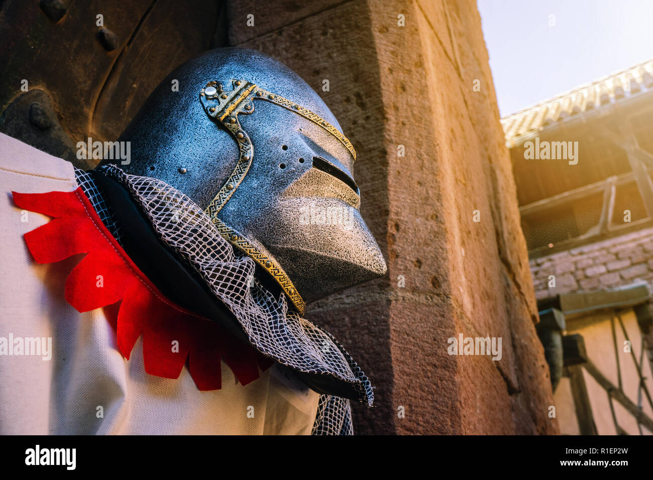 Medieval knight costume with helm and copy space on the right. Middle ...