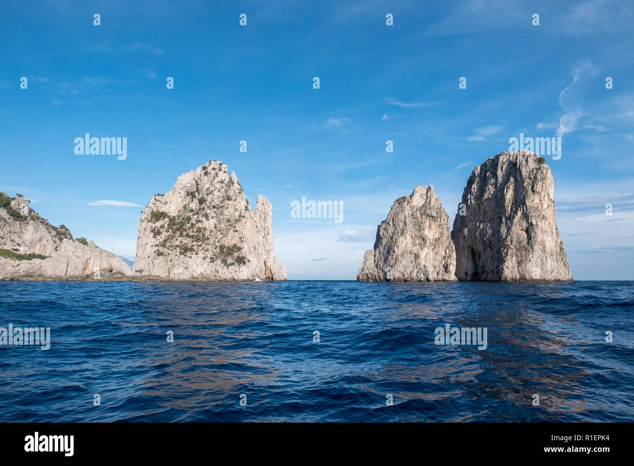 Sea stacks (faraglioni) off the coast of Capri in Bay of Naples, Italy ...