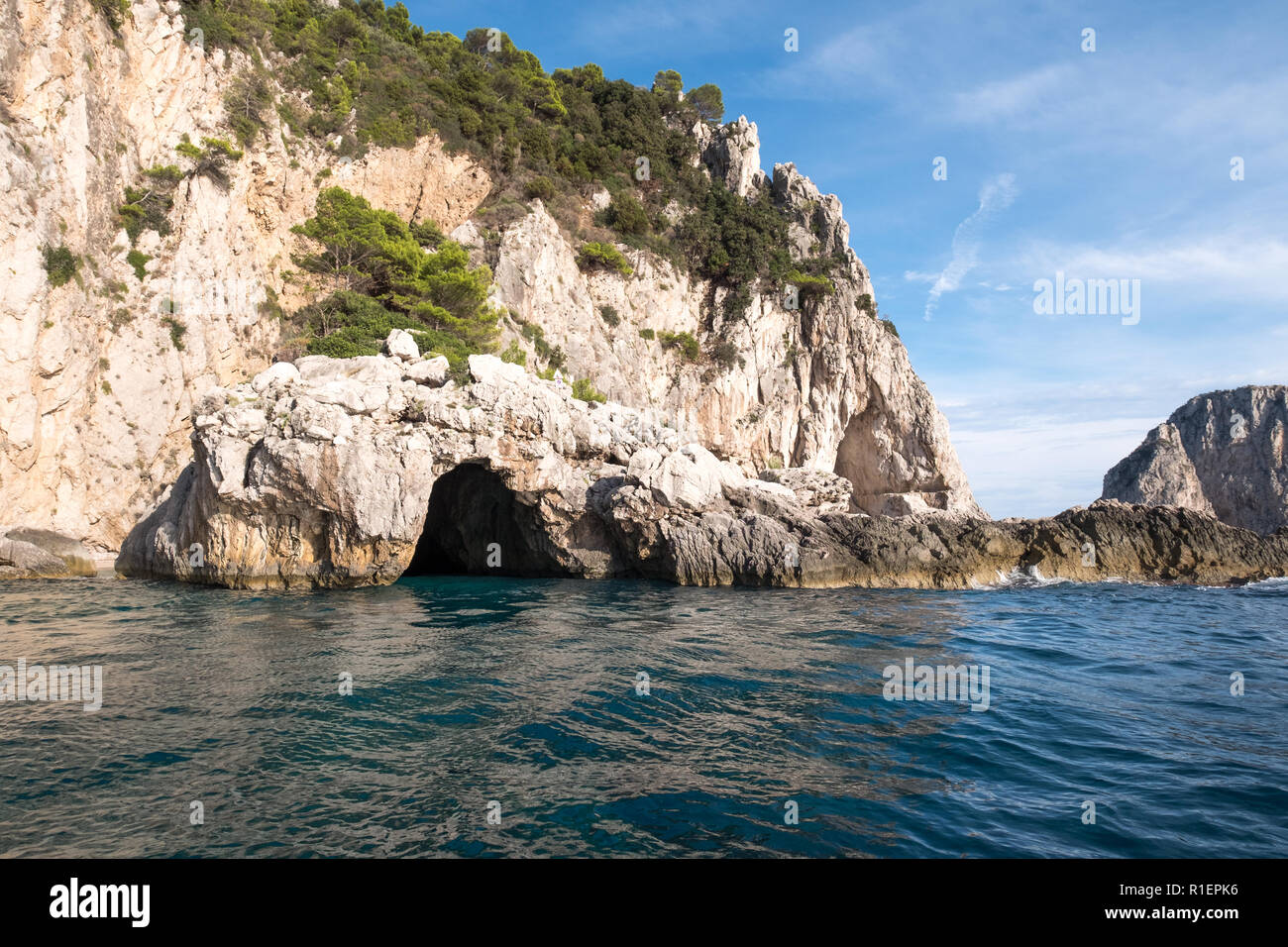 Caves in the cliffs on the island of Capri in the Bay of Naples, Italy ...