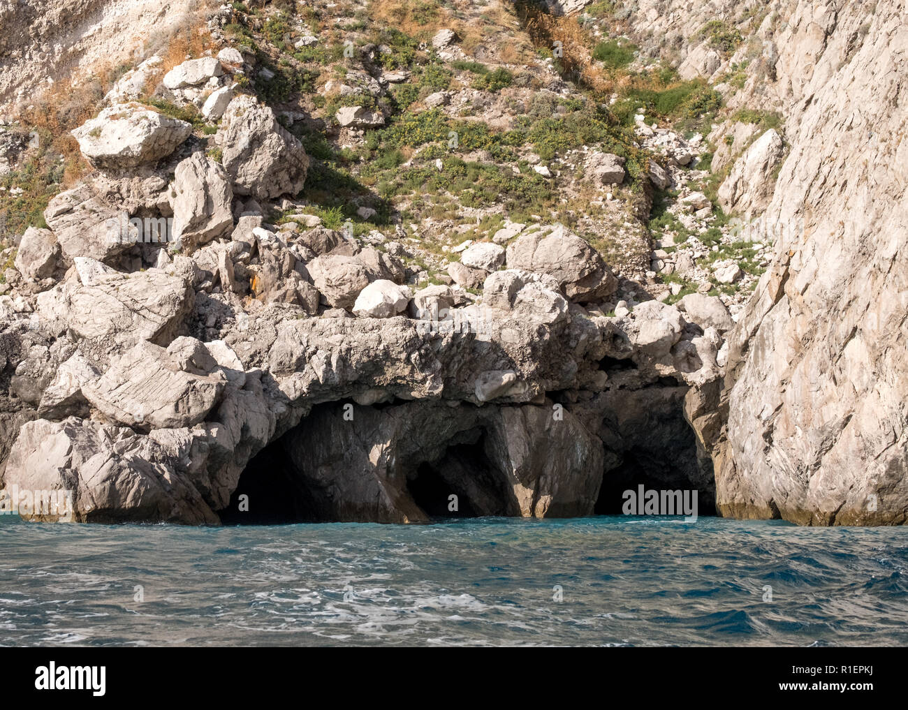 Caves in the cliffs on the island of Capri in the Bay of Naples, Italy ...