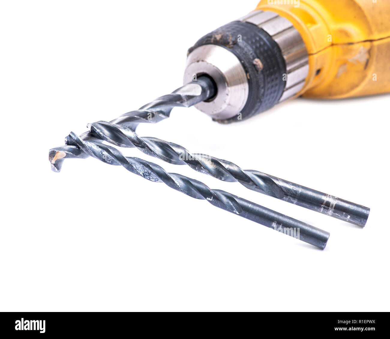 Old drill gun with used drill bit isolated on white background Stock ...