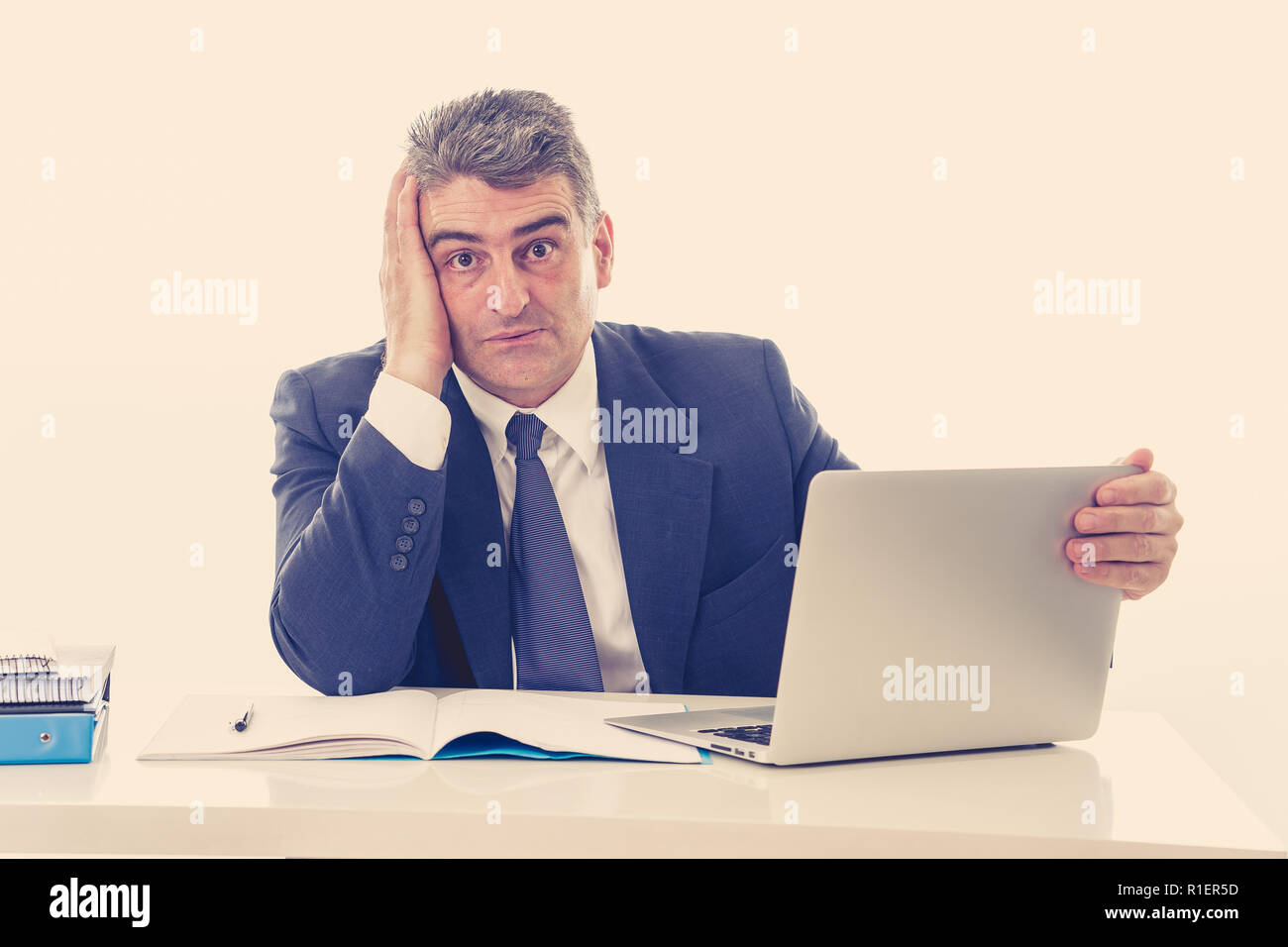 Angry and desperate businessman shouting with laptop computer and ...