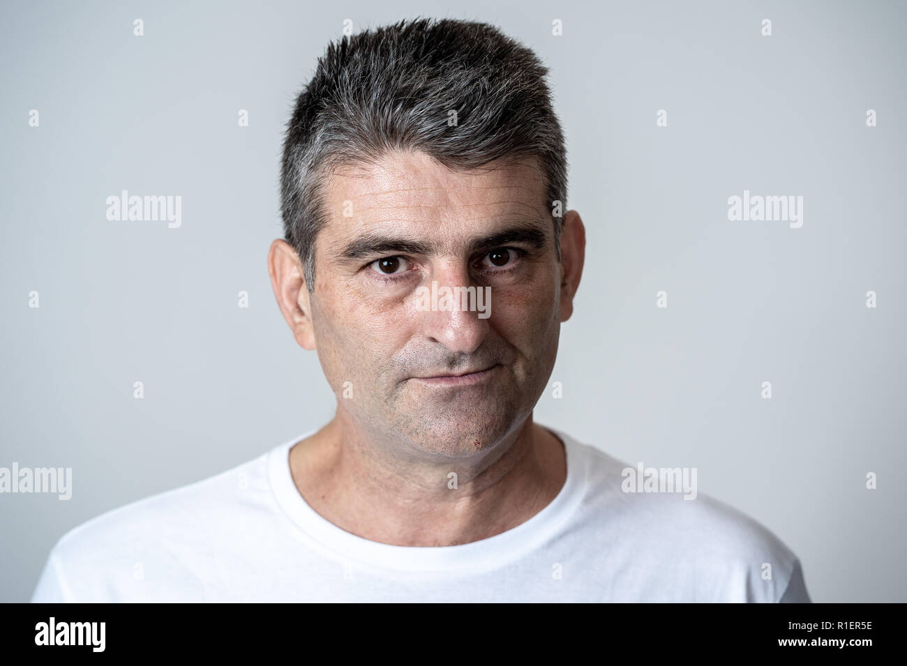 Portrait of a mature 40s to 50s white angry and upset man looking ...