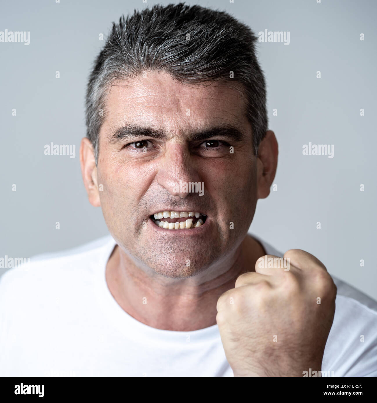 Portrait of a mature 40s to 50s white angry and upset man looking ...
