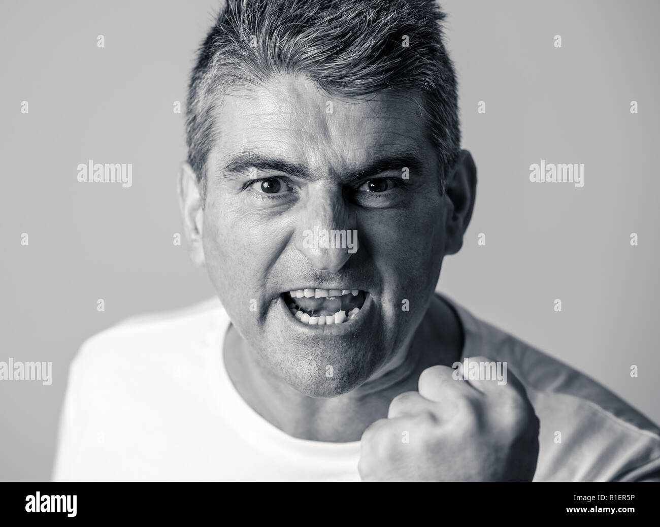 Portrait of a mature 40s to 50s white angry and upset man looking ...