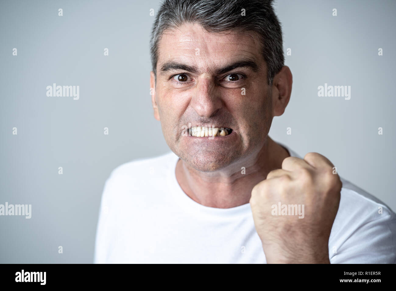 Portrait of a mature 40s to 50s white angry and upset man looking ...