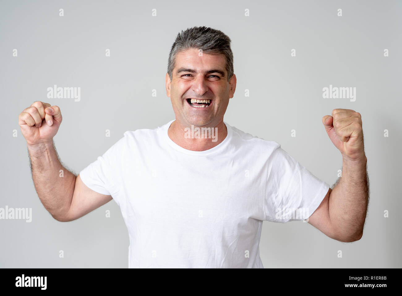 Man rejoices in achieving his goal, wining the lottery or having great ...