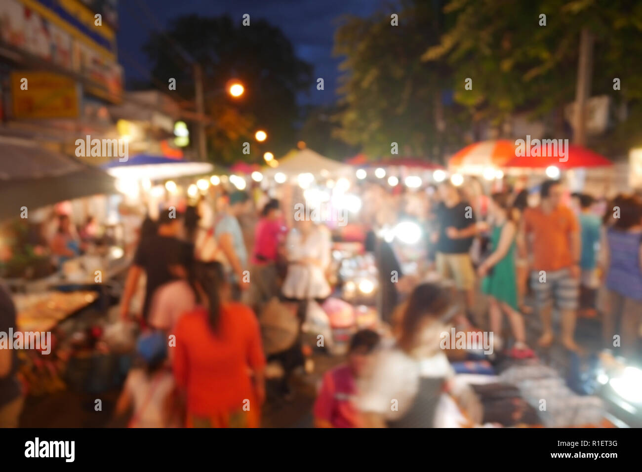 Blurred night market with crowded people Stock Photo - Alamy