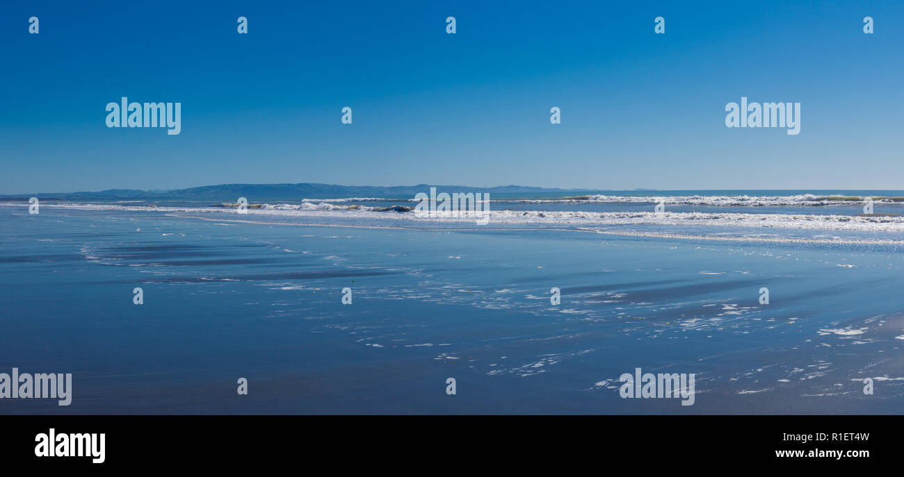 Exploring a local beach on a beautiful Spring morning Stock Photo - Alamy