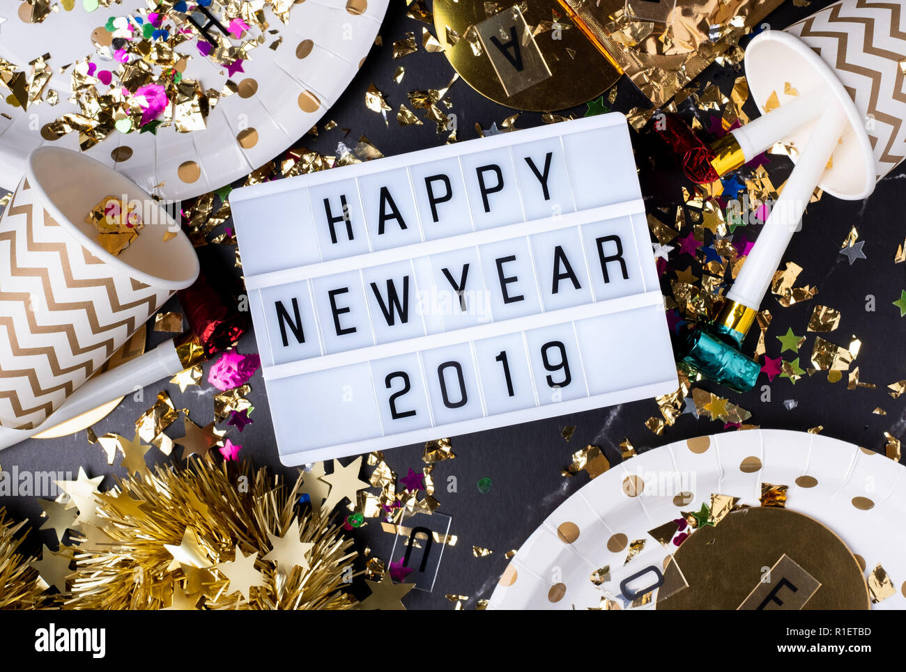 Happy new year 2019 on light box with party cup,party blower,tinsel ...