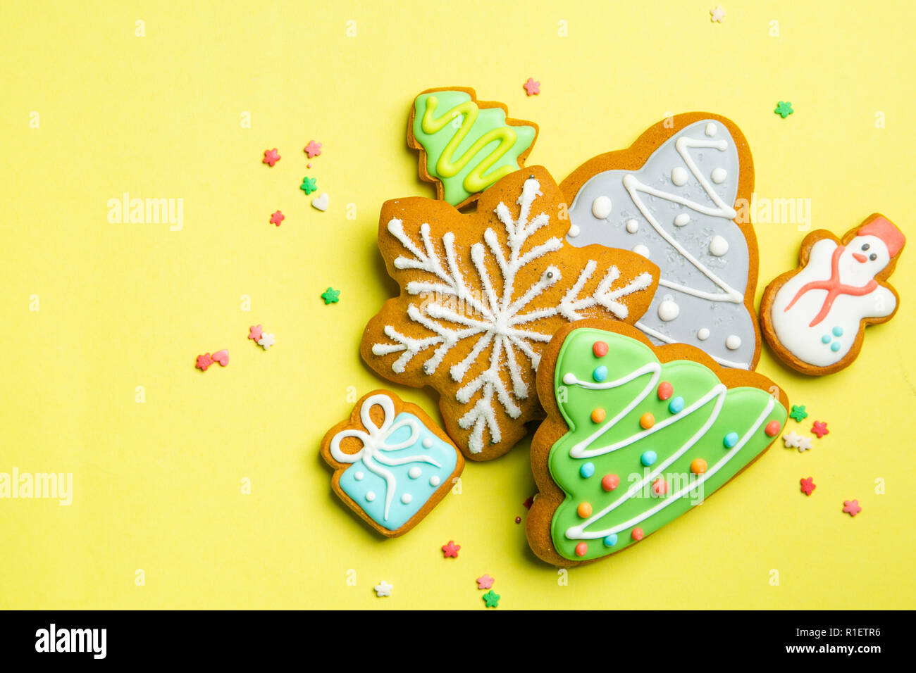 Christmas cookies on bright yellow background Stock Photo - Alamy