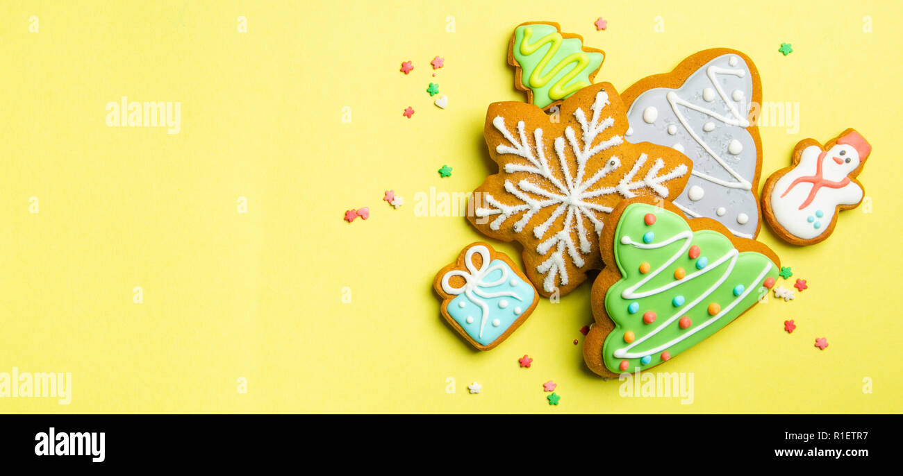 Christmas cookies on bright yellow background Stock Photo - Alamy