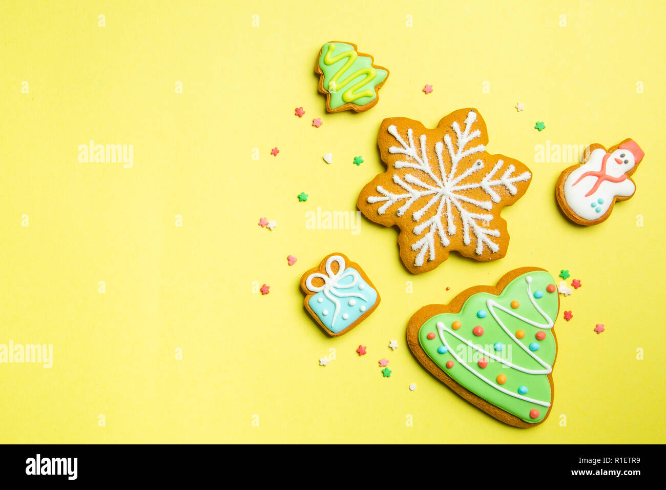 Christmas cookies on bright yellow background Stock Photo - Alamy