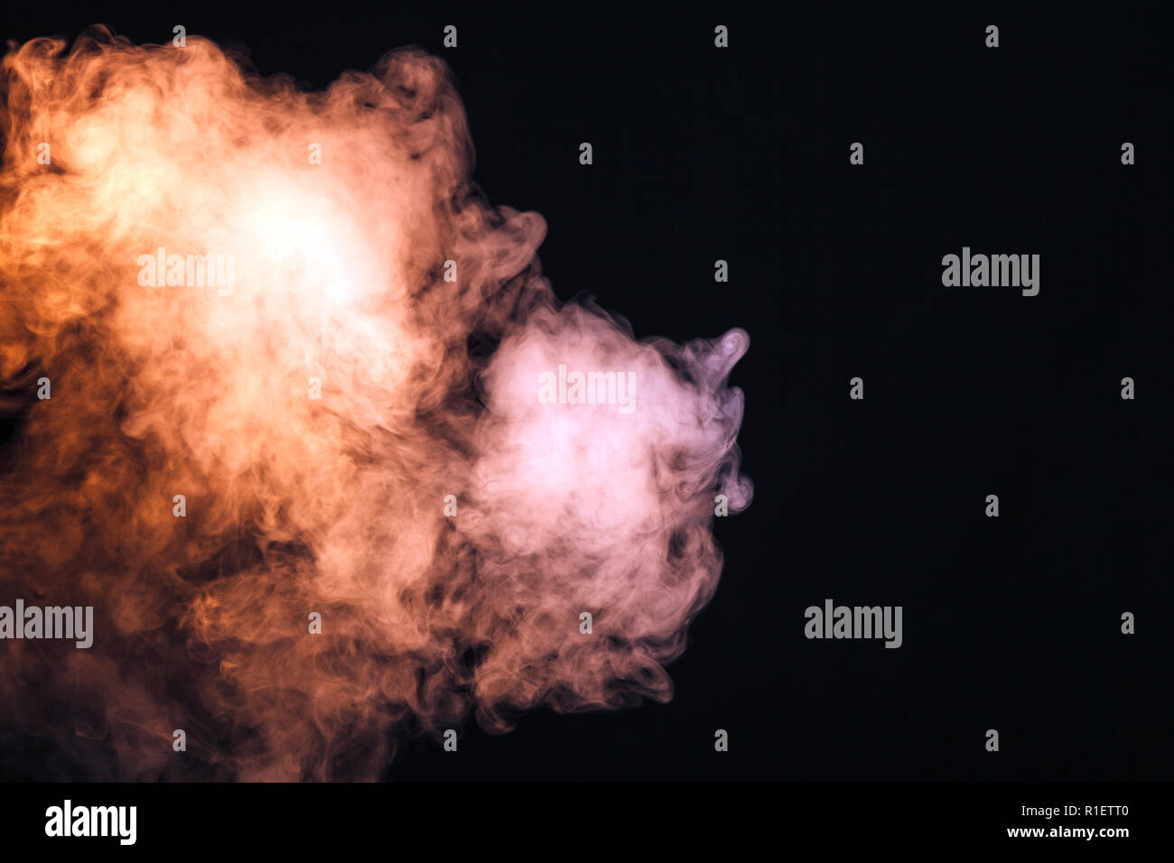 Colored smoke on a black background. The concept of a light show at a ...