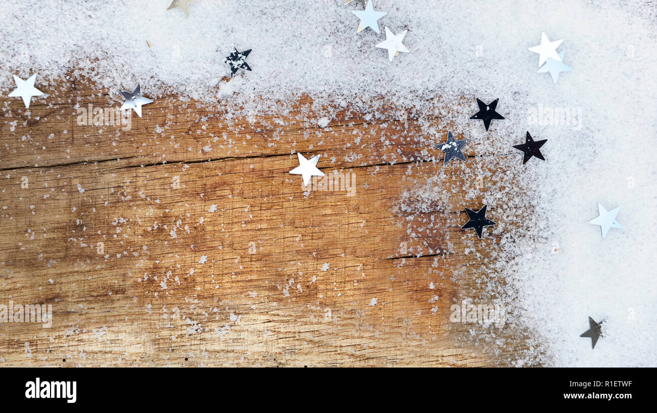 bright stars shape and snow on a plank background Stock Photo - Alamy
