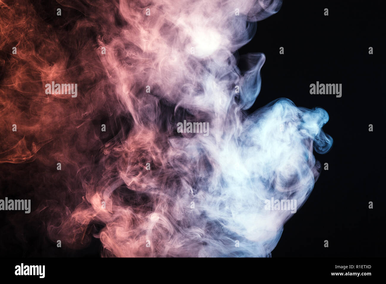 Colored smoke on a black background. The concept of a light show at a ...