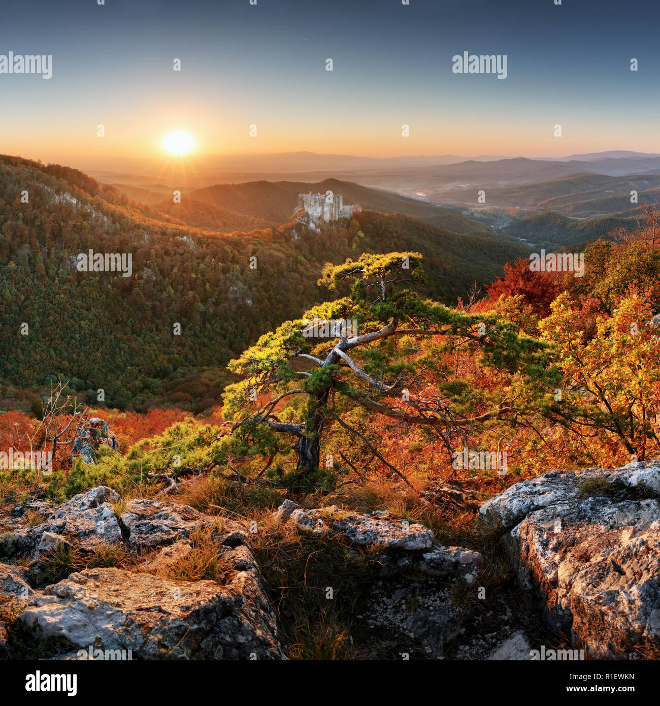 Mountain autumn landscape with colorful forest and Uhrovec castle ...