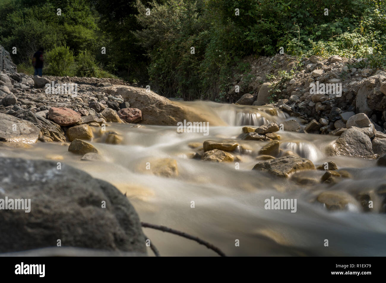Mountain river with Rapid stream and with bright blurred waves. Big ...