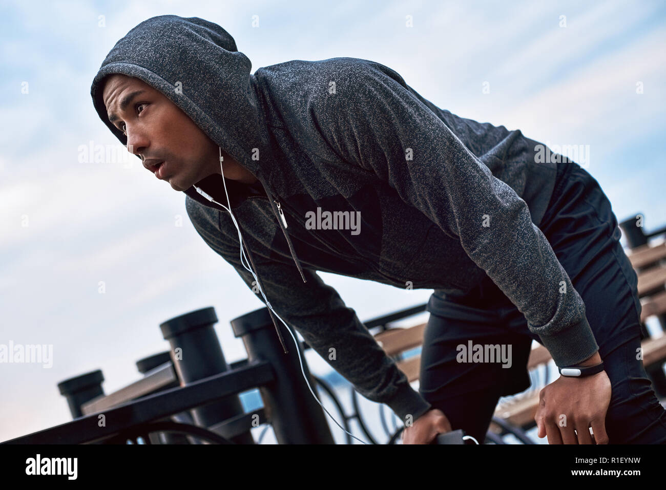 Black male runner with jacket hi-res stock photography and images - Alamy