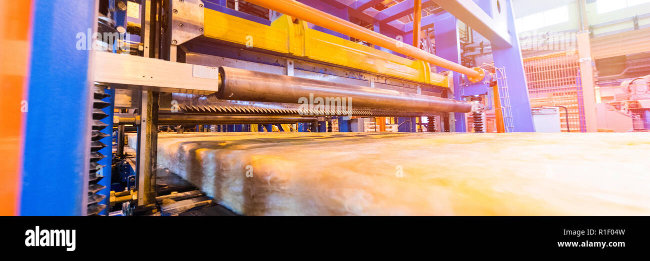 Fiberglass production industry equipment at manufacture background ...