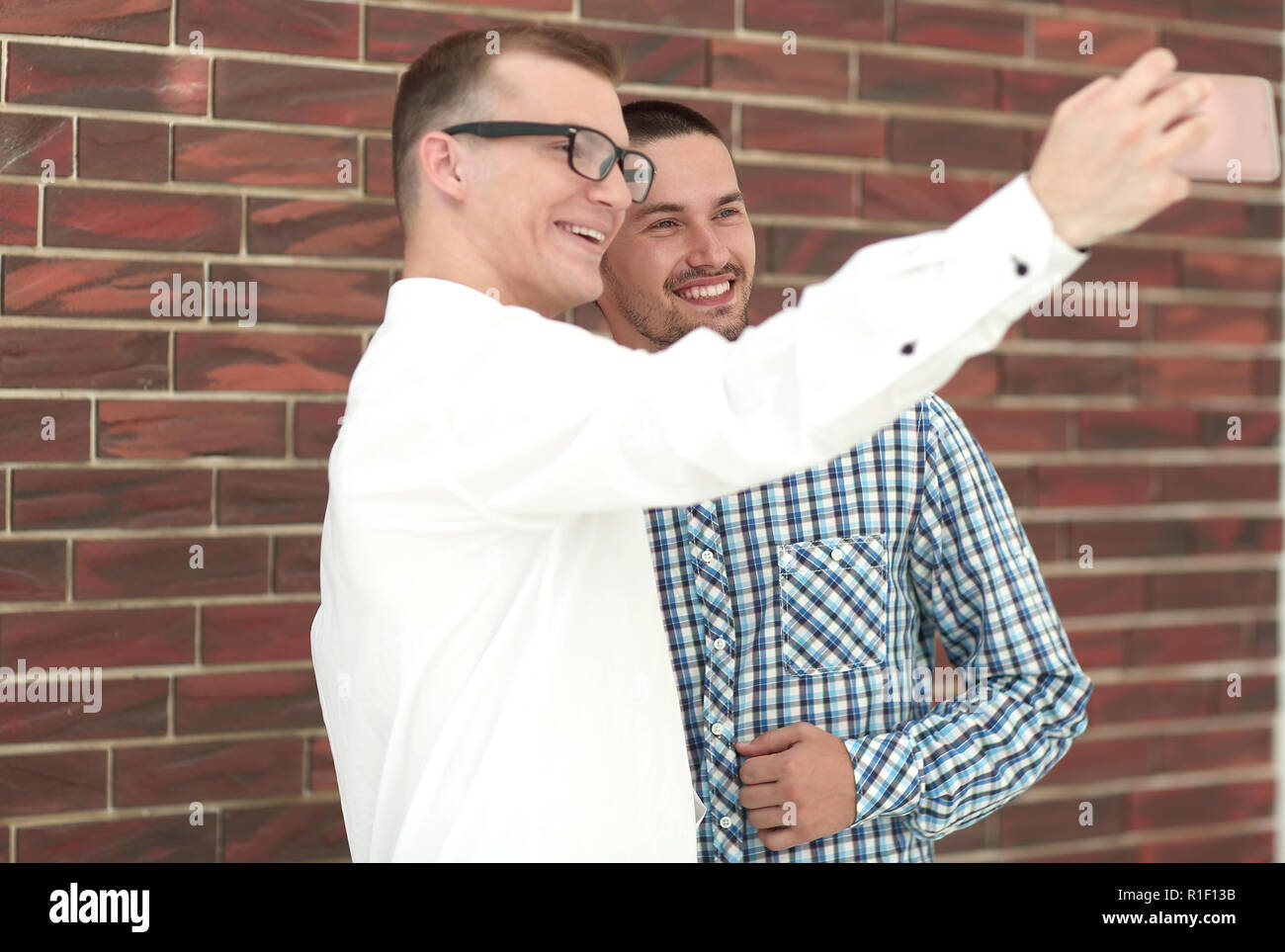 Two men standing together hi-res stock photography and images - Alamy