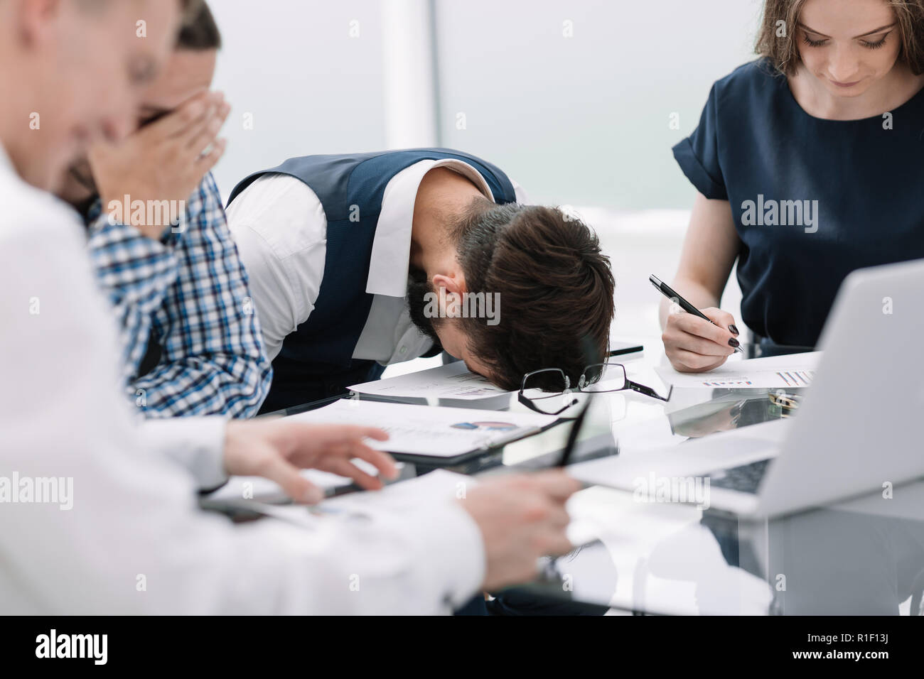 tired employee at a business meeting in the office Stock Photo - Alamy