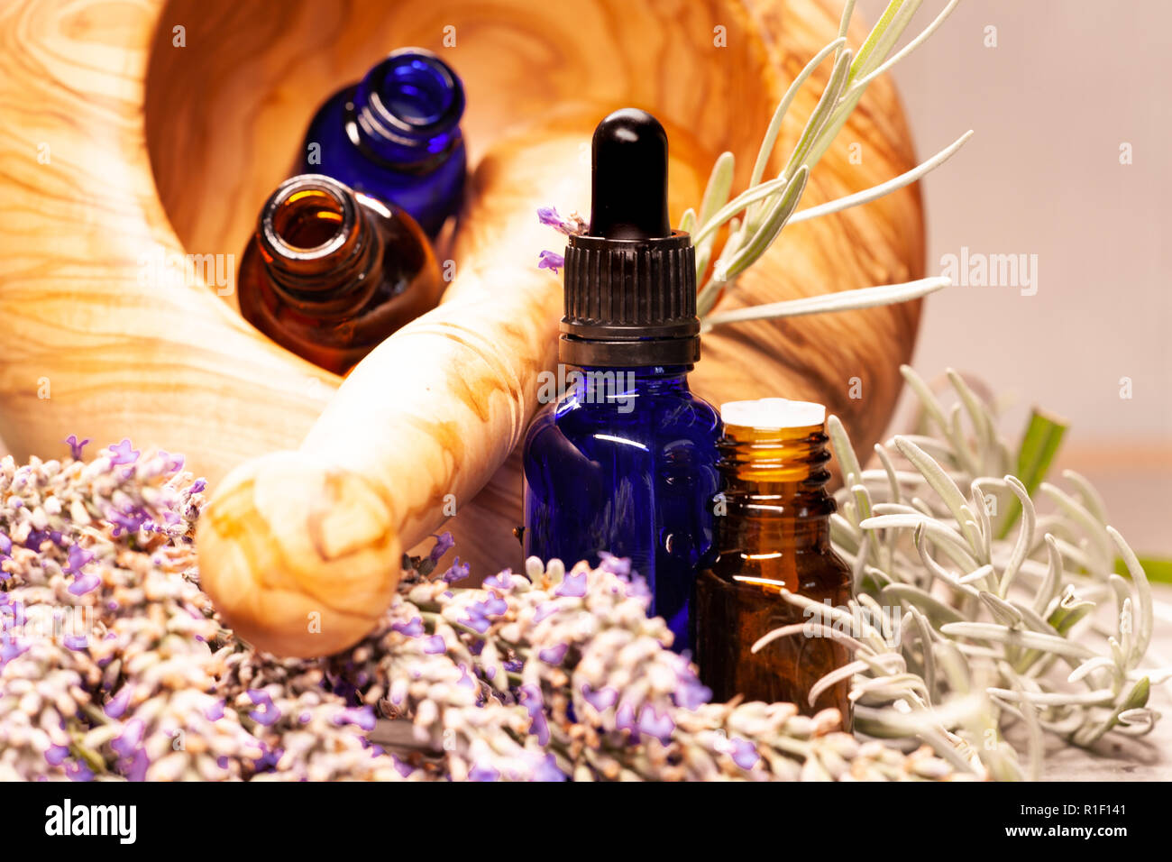 lavender mortar and pestle and bottles of essential oils for aromatherapy Stock Photo - Alamy