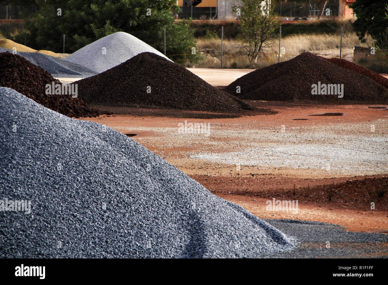 Colorful construction aggregate mountains in Alicante, Spain Stock ...