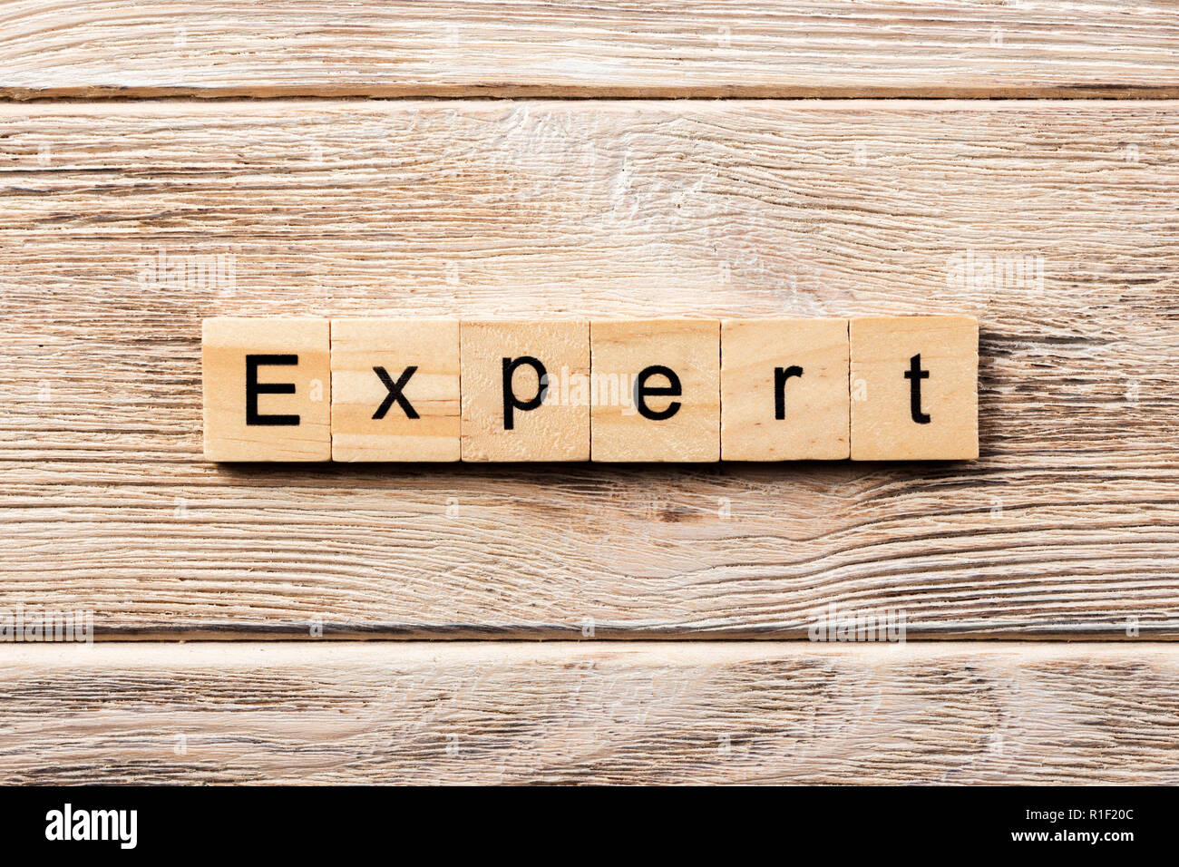 expert word written on wood block. expert text on table, concept Stock ...
