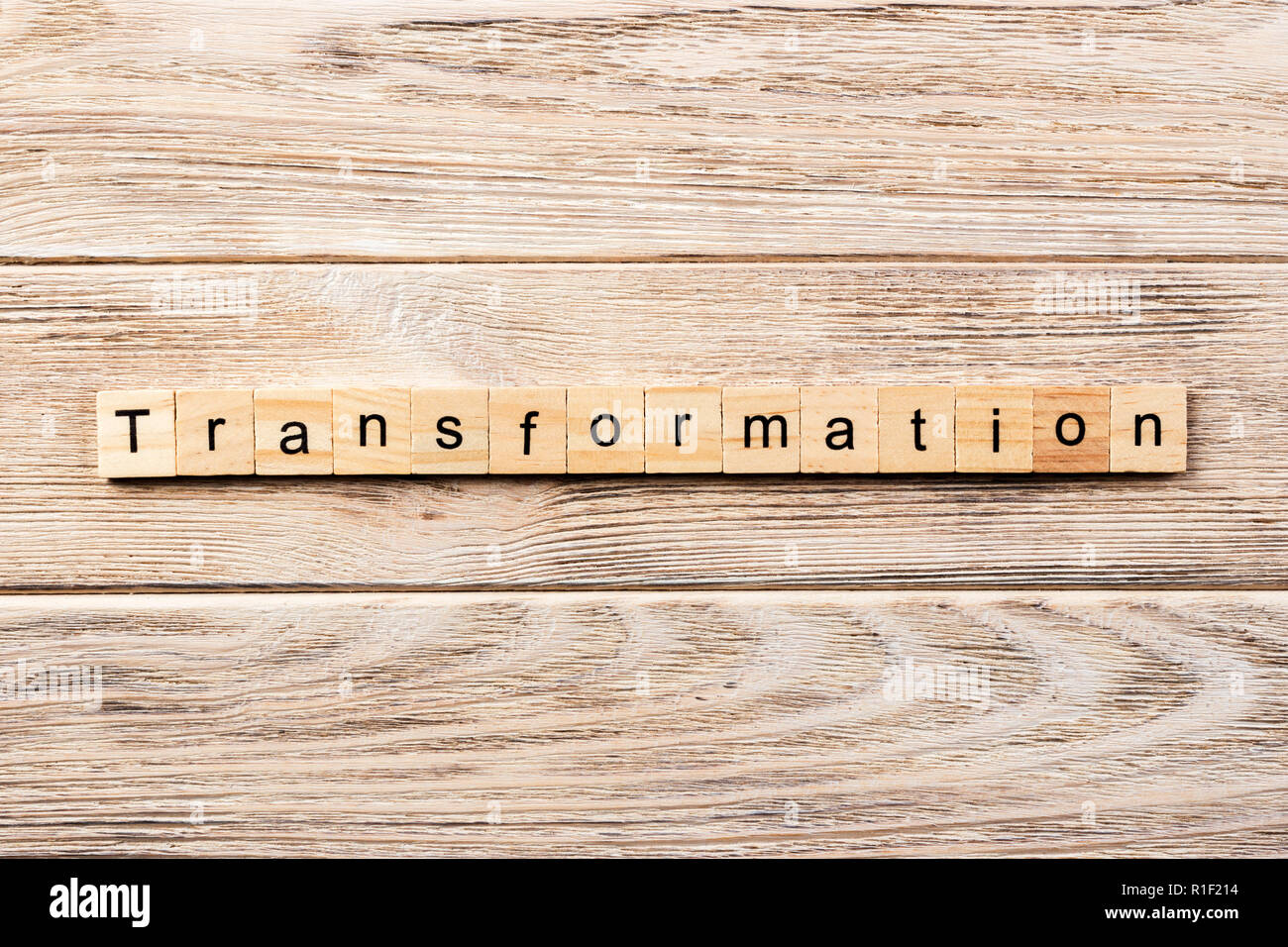 transformation word written on wood block. transformation text on table ...