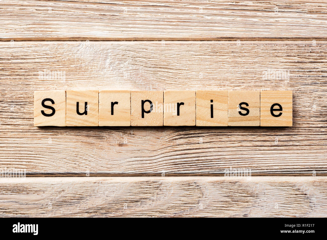 surprise word written on wood block. surprise text on table, concept ...
