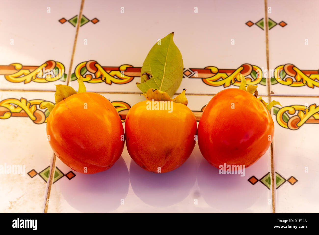 Diospyros kaki, Persimmon Fruit, ripe and ready to eat Stock Photo - Alamy