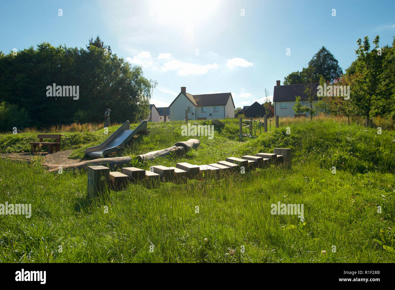 Urban development with eco communal play area Stock Photo - Alamy