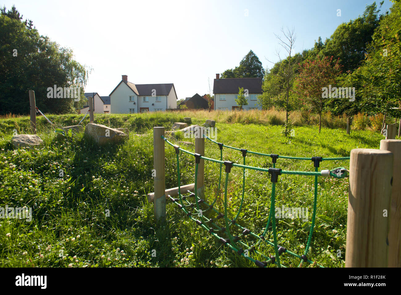 Urban development with eco communal play area Stock Photo - Alamy