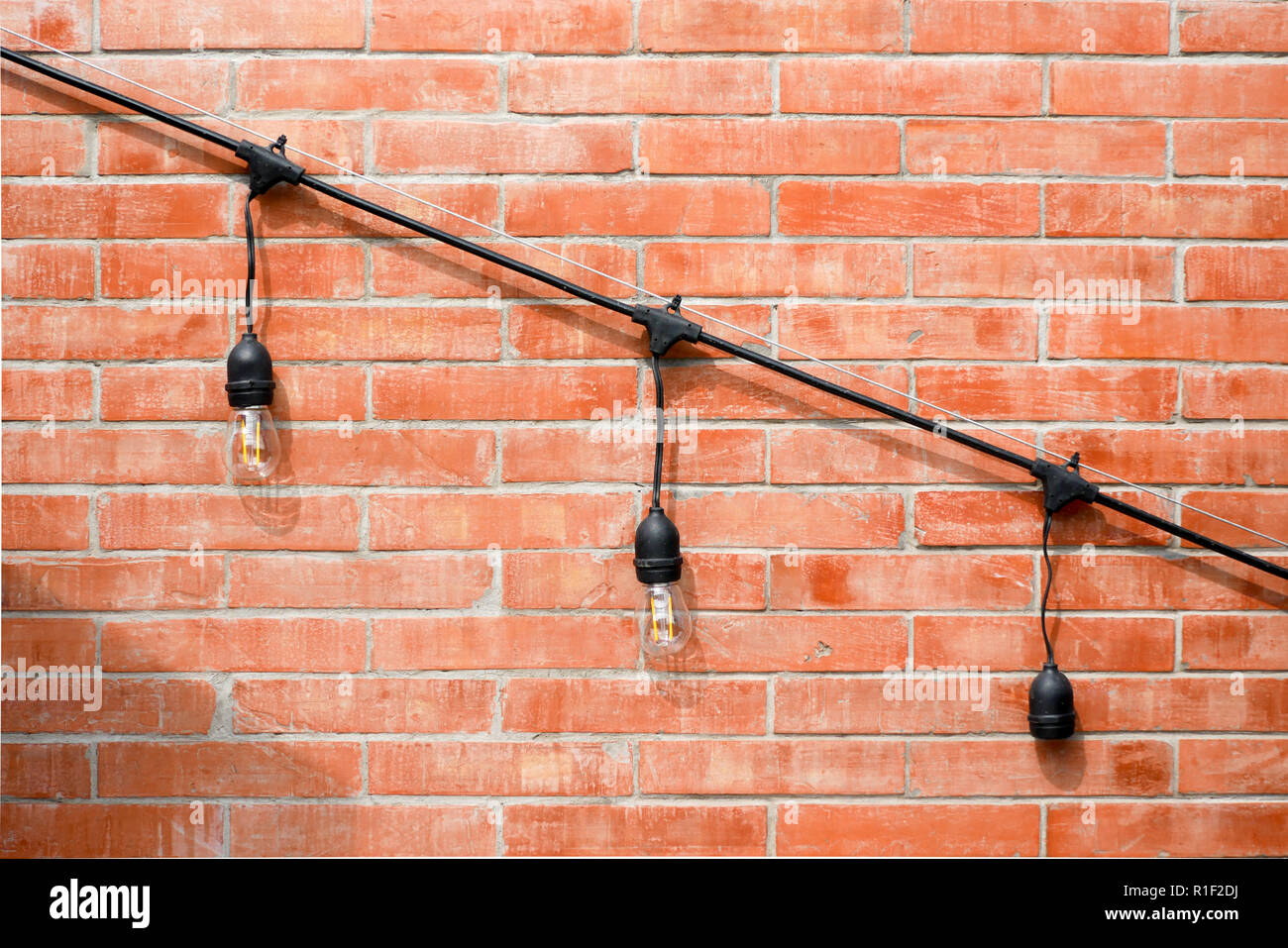 lamp on brick wall interior design Stock Photo - Alamy