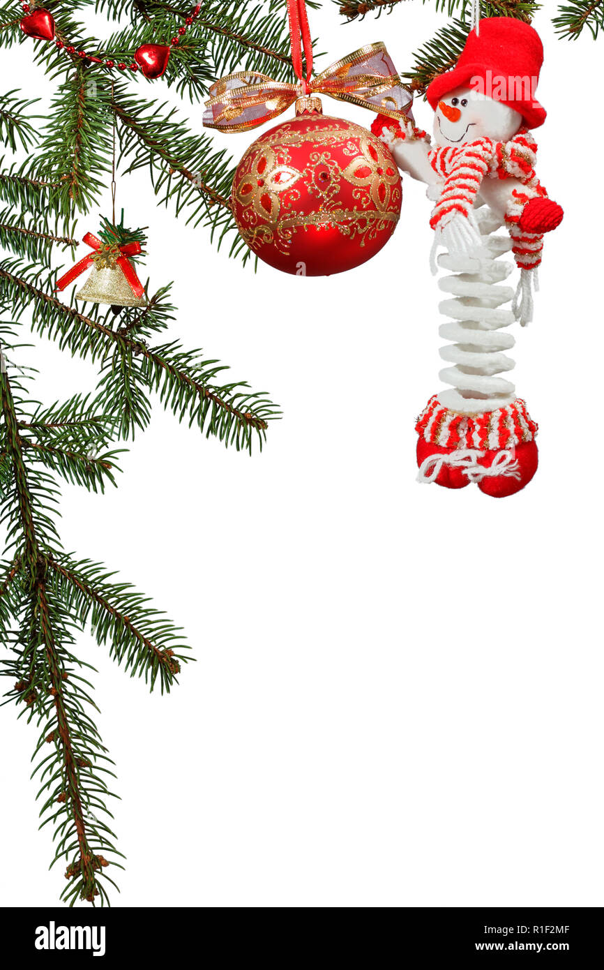 Branches of natural fir tree with toy snowman and other Christmas ...