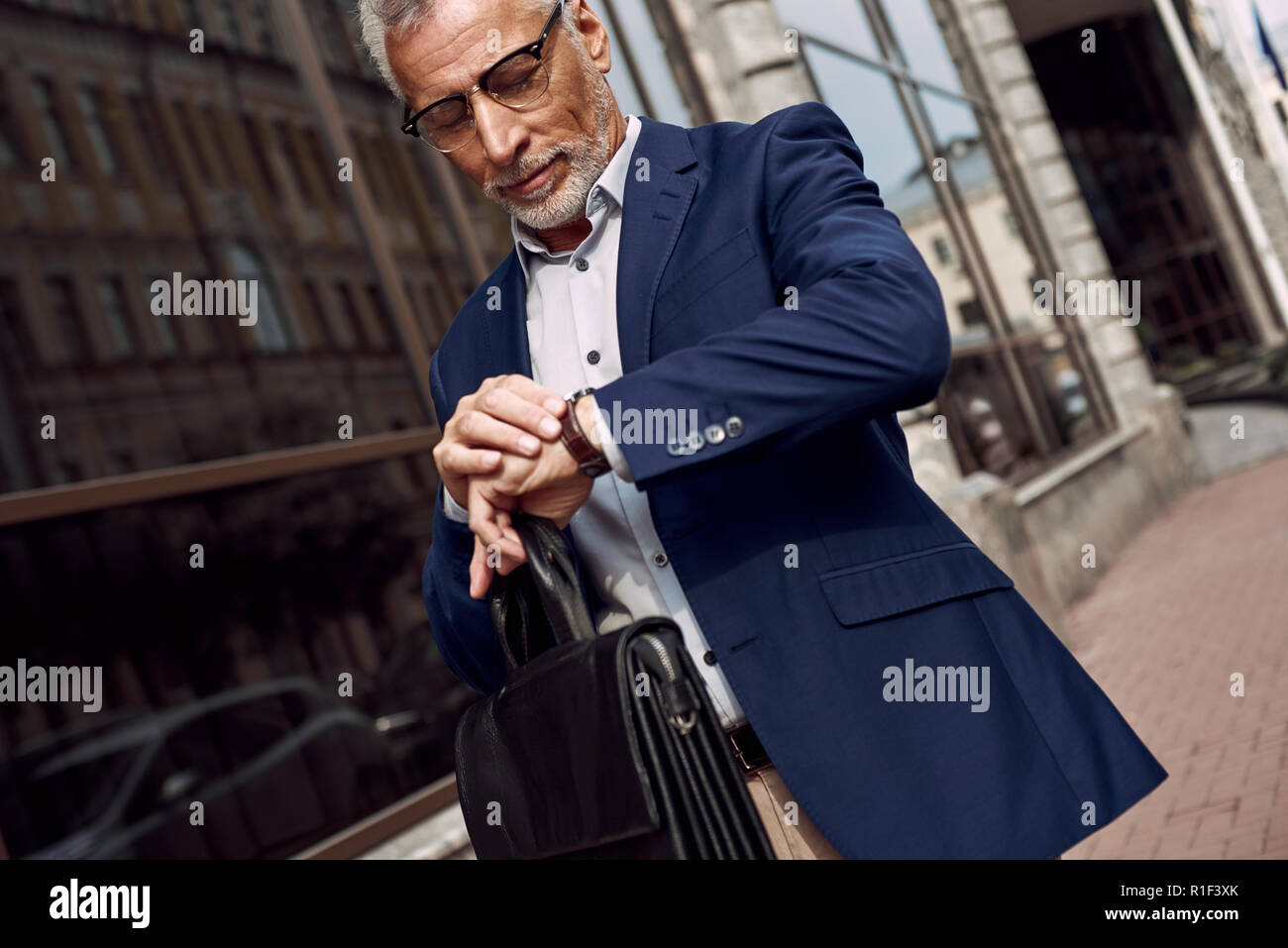 Checking the time hi-res stock photography and images - Alamy