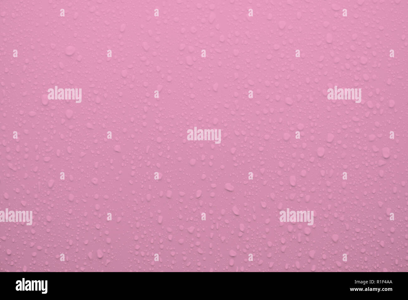 Water drops on pastel pink surface as background Stock Photo - Alamy
