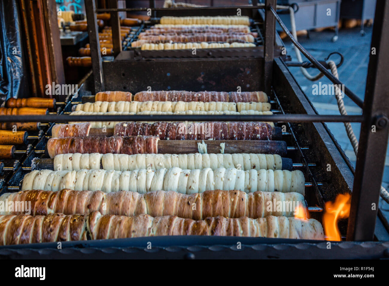 Traditional Czech pastry Trdelnik rotating at a booth at a Christmas ...