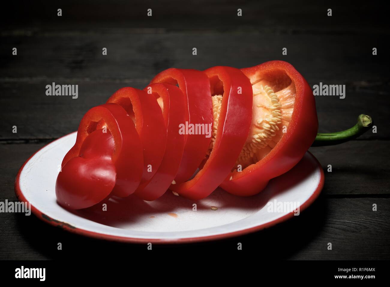 Red pepper on a wood table Stock Photo - Alamy