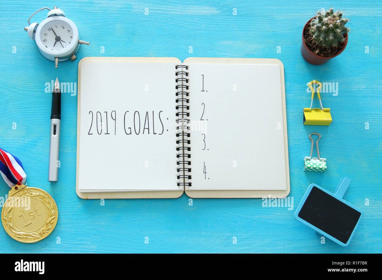 Top view 2019 goals list with notebook over wooden desk Stock Photo - Alamy