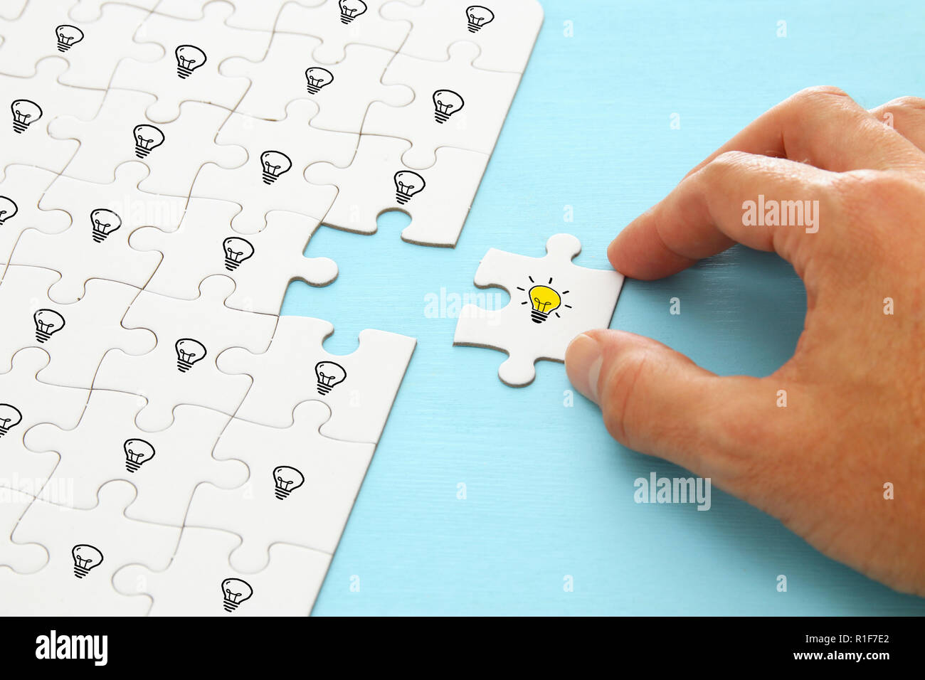 Concept image of revealing an idea, finding the right solution during ...