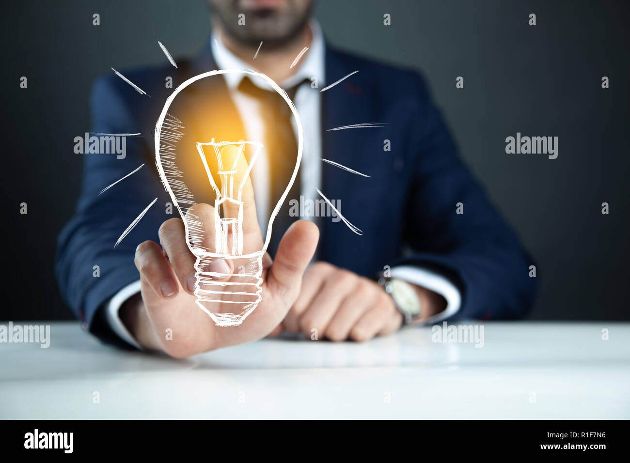 man touching bulb in screen Stock Photo - Alamy