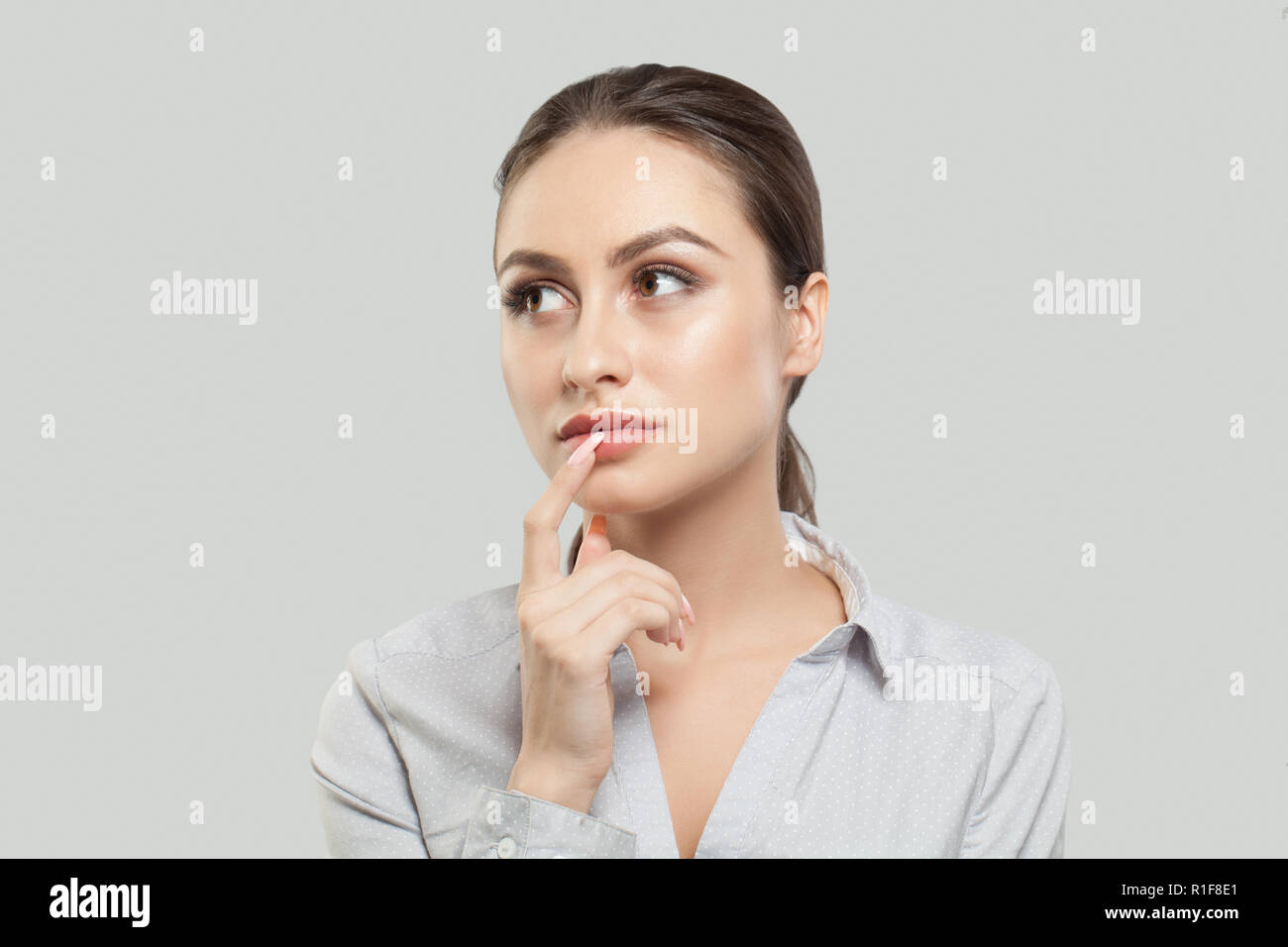 Thinking woman on white background, portrait Stock Photo - Alamy