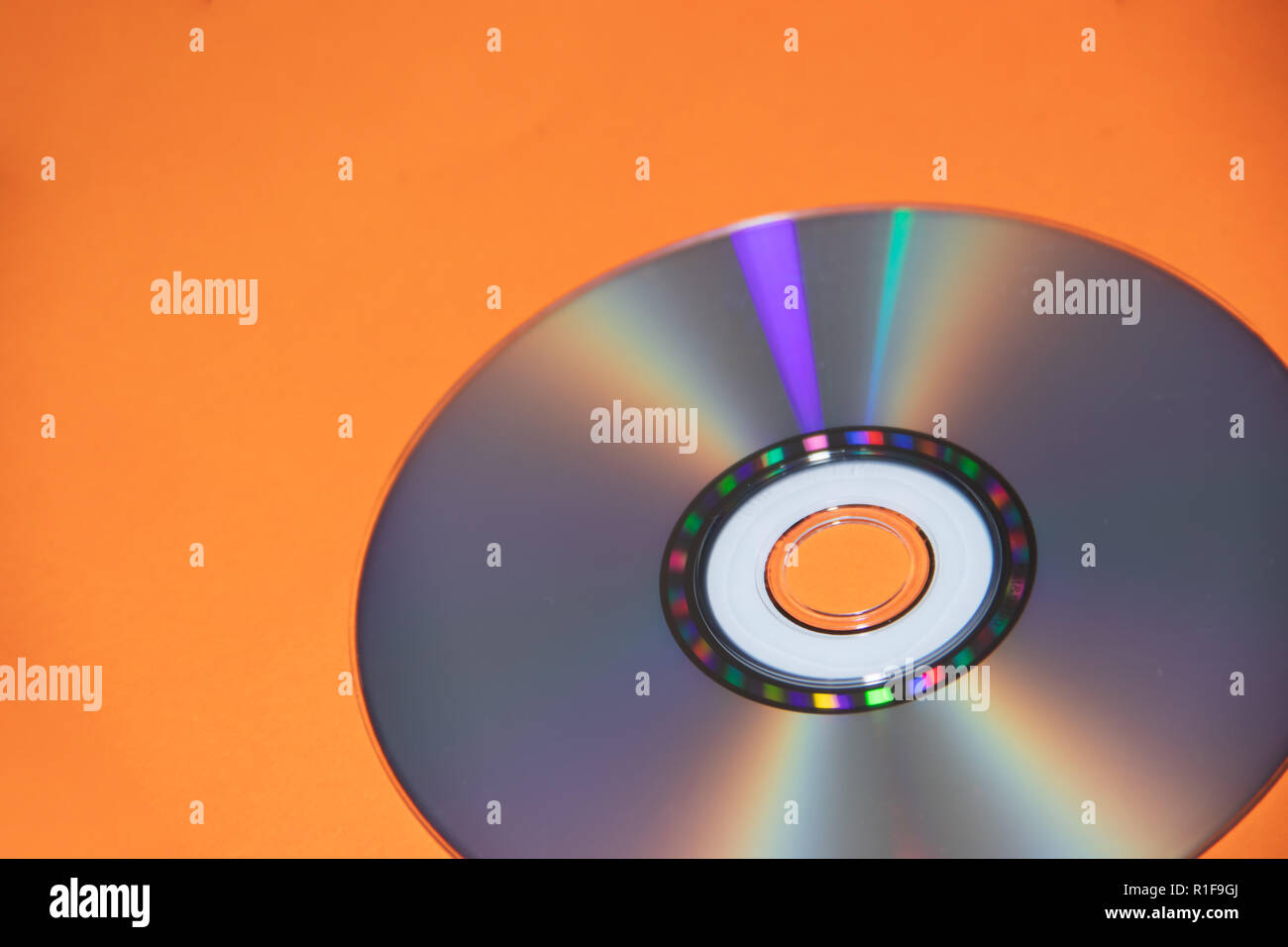 dvd disk on an orange background. CD. isolated object Stock Photo - Alamy